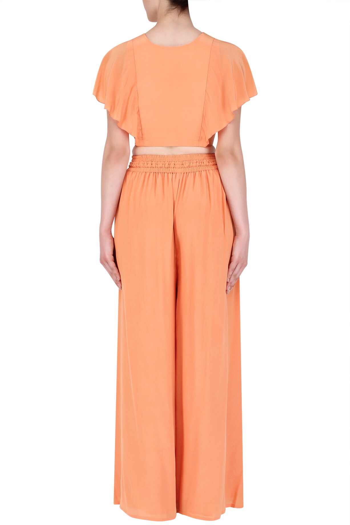 Coral peach embroidered top with flared pants available only at Pernia ...
