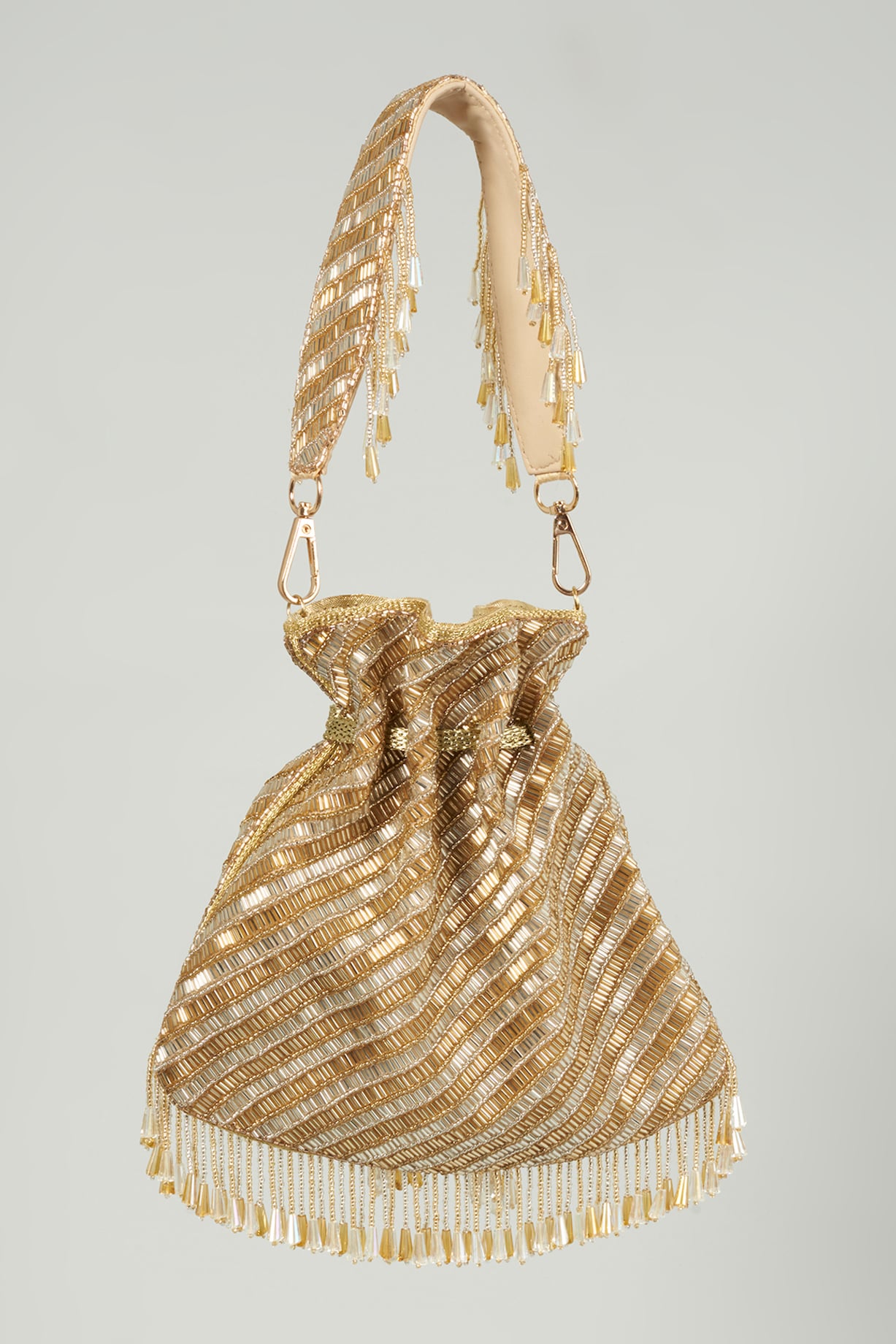 Gold Raw Silk Salli Embroidered Potli by Aloha by PS at Pernia's Pop Up ...