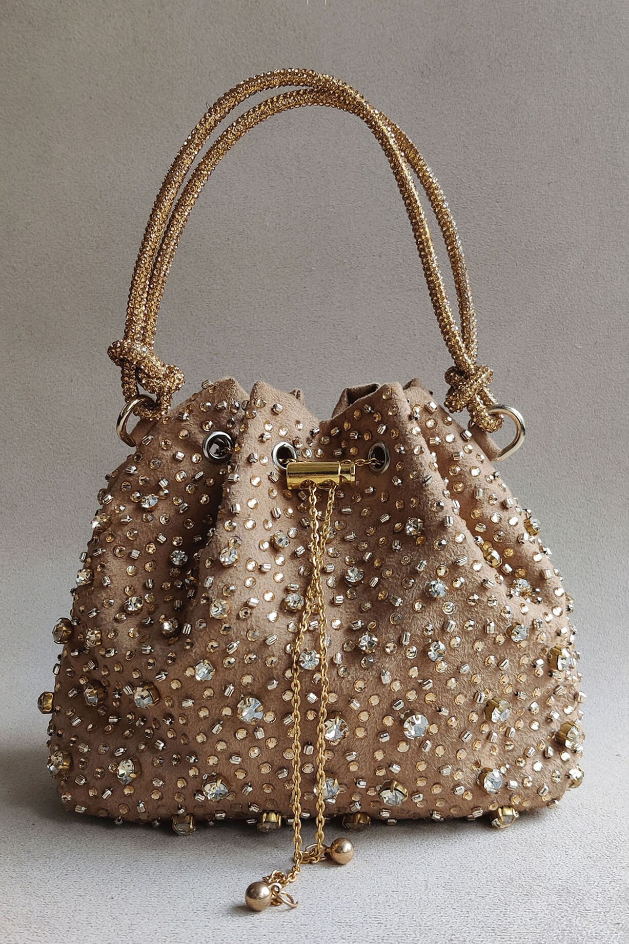 Gold Hand Embellished Bucket Bag by PLODE at Pernia's Pop Up Shop 2026