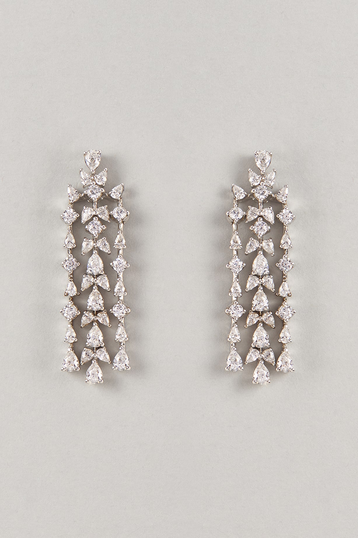 Silver Finish Zircon Dangler Earrings In Sterling Silver by Diosa Paris Jewellery at Pernia's ...