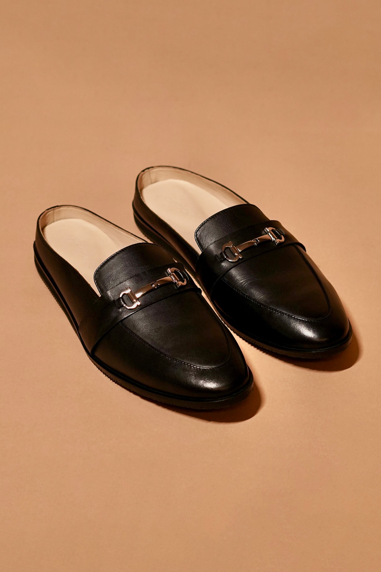Black Leather Slip-On Mules by Dmodot at Pernia's Pop Up Shop 2025