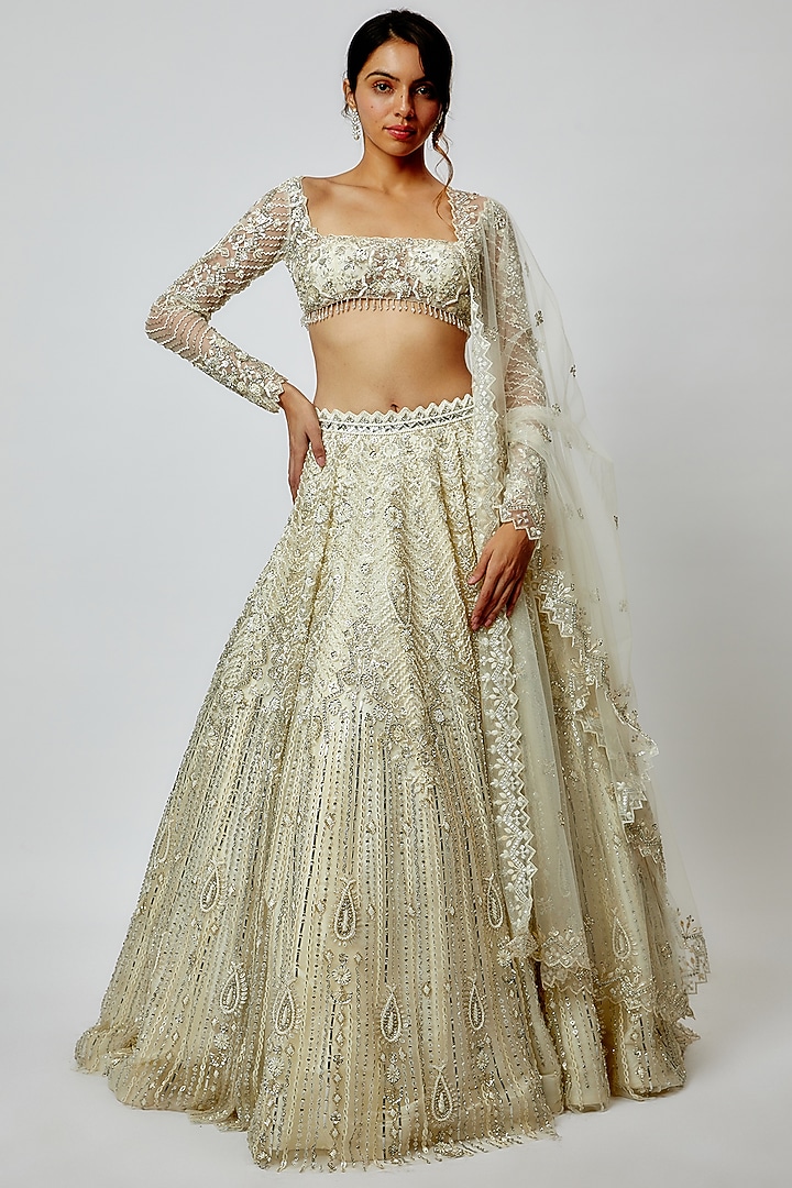 Ivory Net Embroidered Bridal Lehenga Set by Isa by Dolly Wahal at ...