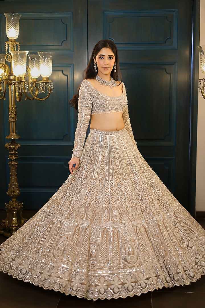 Nude Net Floral Embroidered Bridal Lehenga Set by Isa by Dolly Wahal at ...