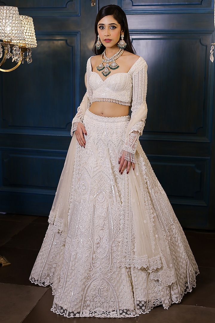 Ivory Net Sequins Embroidered Bridal Lehenga Set by Isa by Dolly Wahal ...