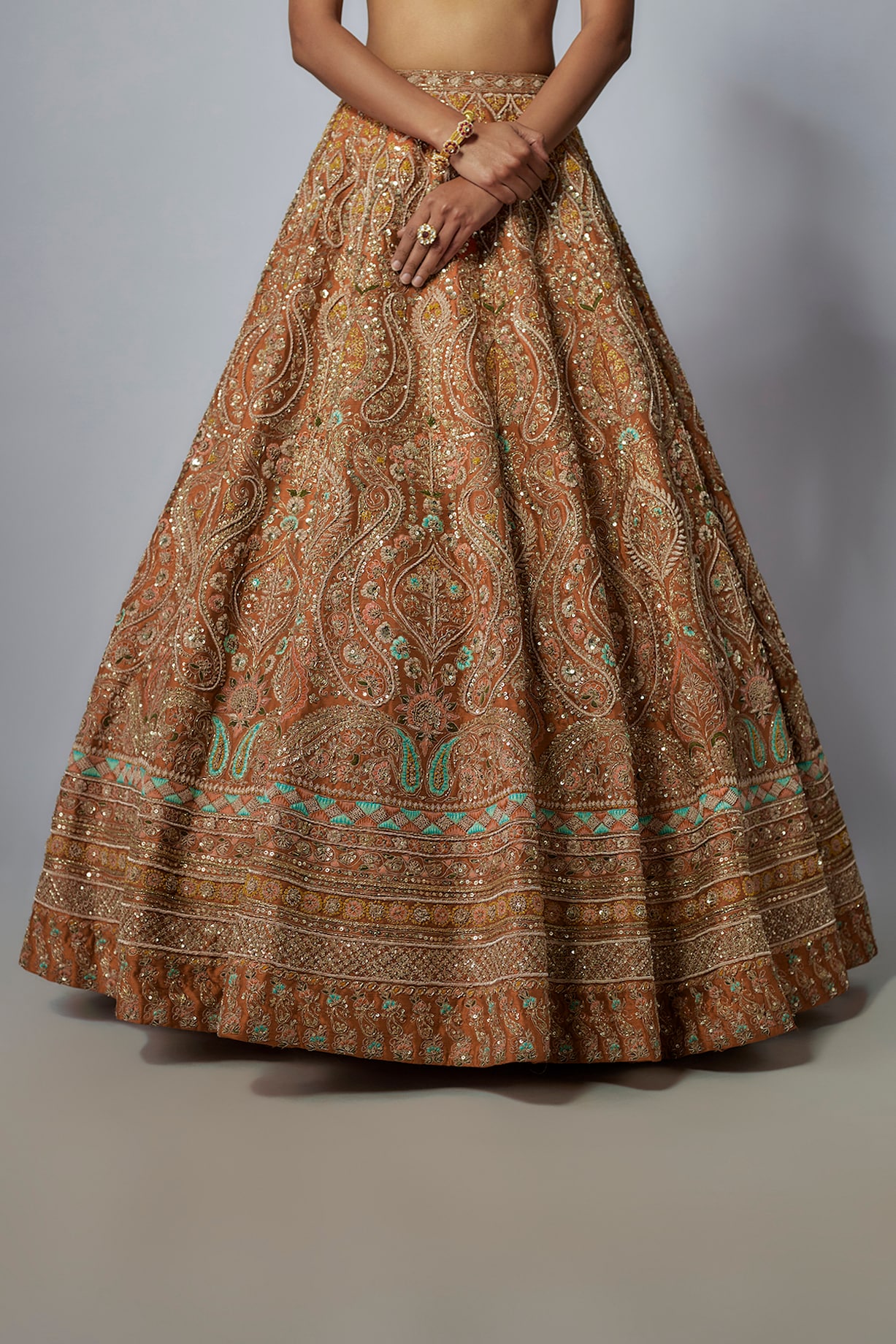 Rust Raw Silk Embellished Bridal Lehenga Set By Kalighata At Pernias