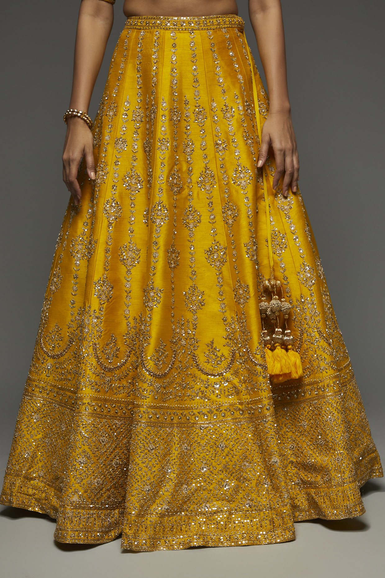 Mustard Raw Silk Embellished Wedding Lehenga Set By Kalighata At Pernia