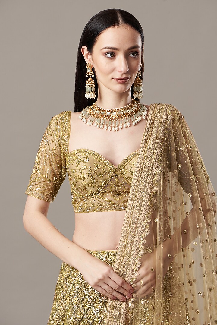 Gold Net Embroidered Bridal Lehenga Set By Megha And Jigar At Pernias