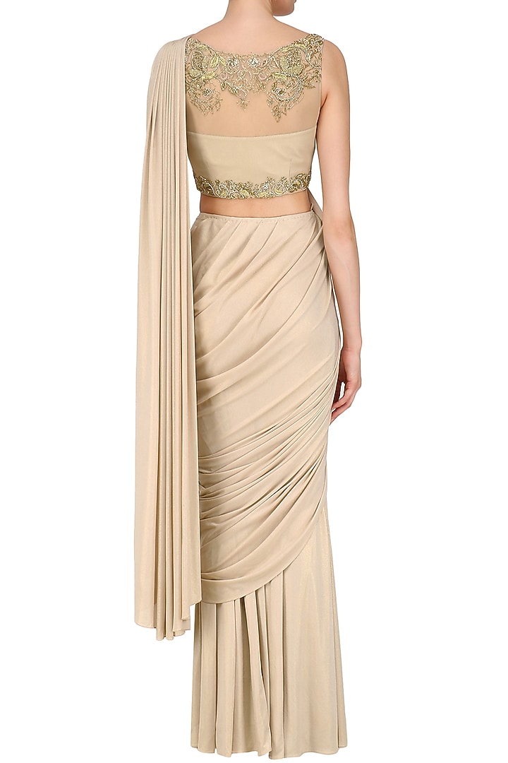 Light gold hand embroidered shimmer drape saree available only at ...