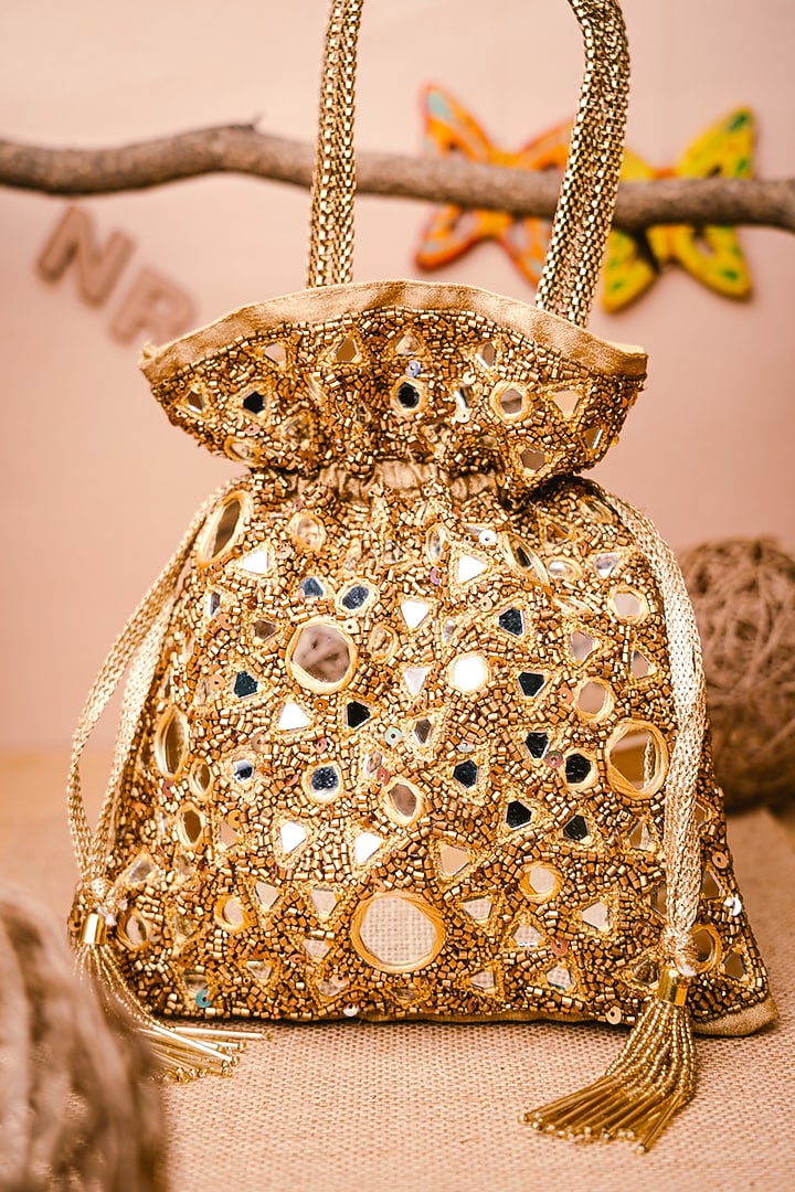 Gold Raw Silk Embellished Potli by NR By Nidhi Rathi at Pernia's Pop Up ...