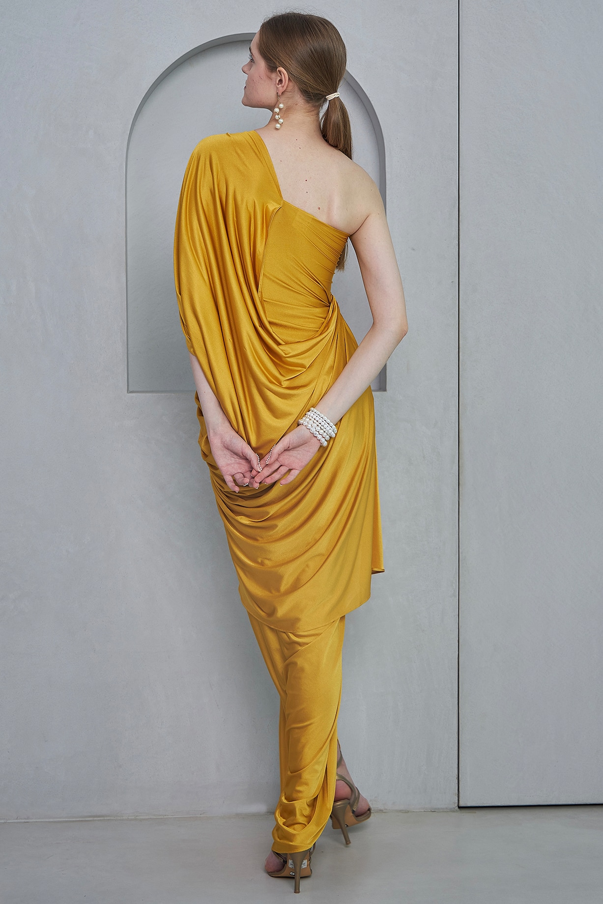 Mustard Stretch Knit Pearl Embellished One-Shoulder Drape Gown by Naina Seth at Pernia's Pop Up ...