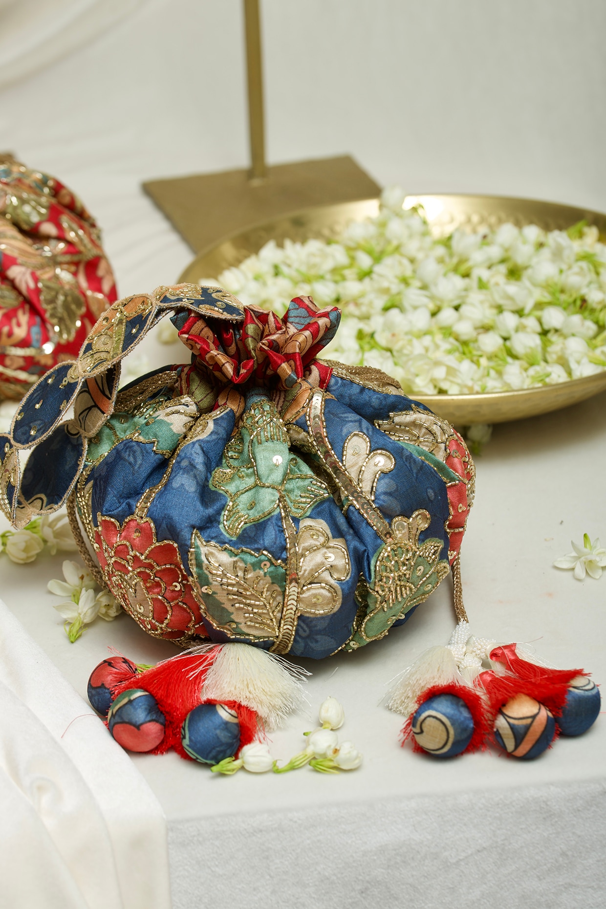 Blue Fabric Printed & Hand Embroidered Potli by Ozel at Pernia's Pop Up ...