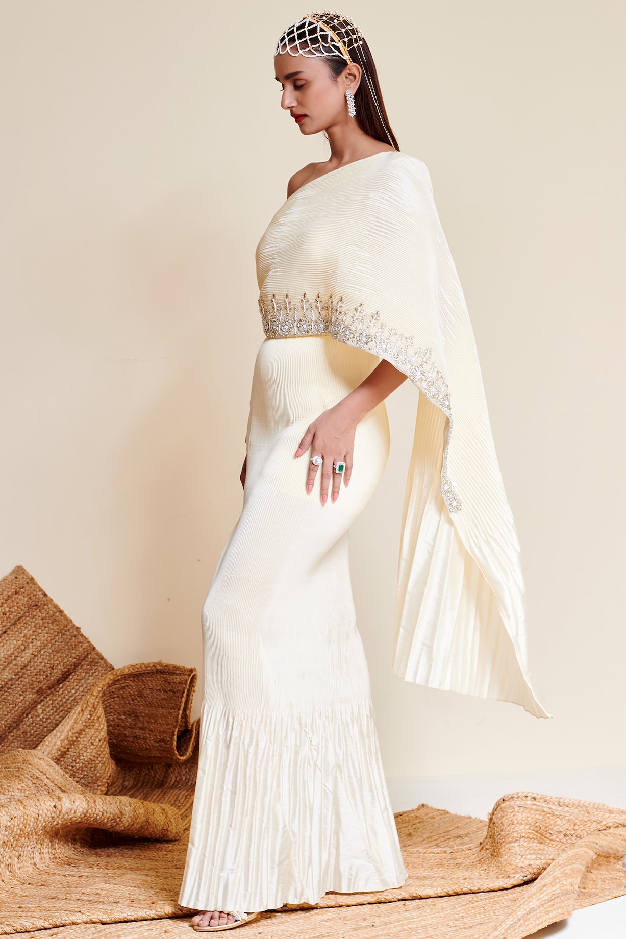 Ivory Taffeta & Pleated Fabric Embellished Gown by Reeti Arneja at ...