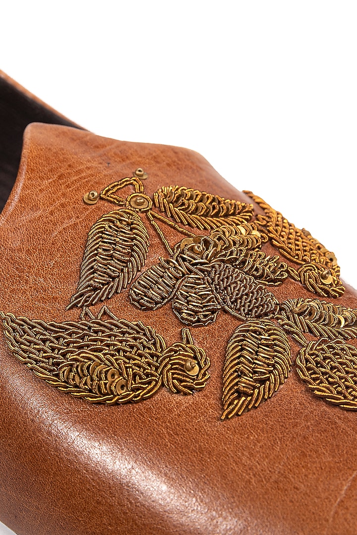 Tan Leather Embellished Mojris by ROHAN ARORA at Pernia's Pop Up Shop 2024