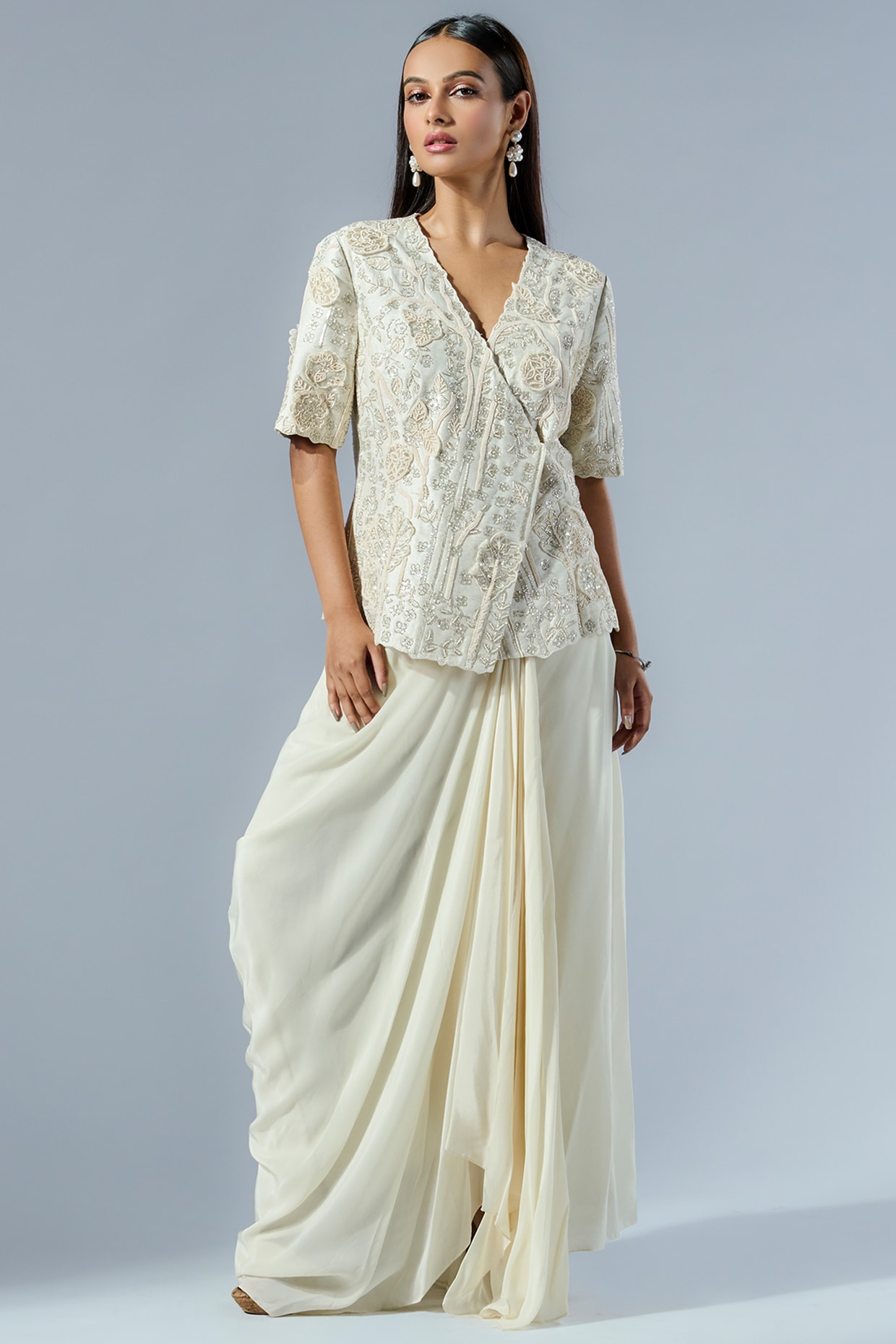 Ivory Crepe 3D Applique Work Draped Skirt Set by Rishi & Soujit at Pernia's Pop Up Shop 2025