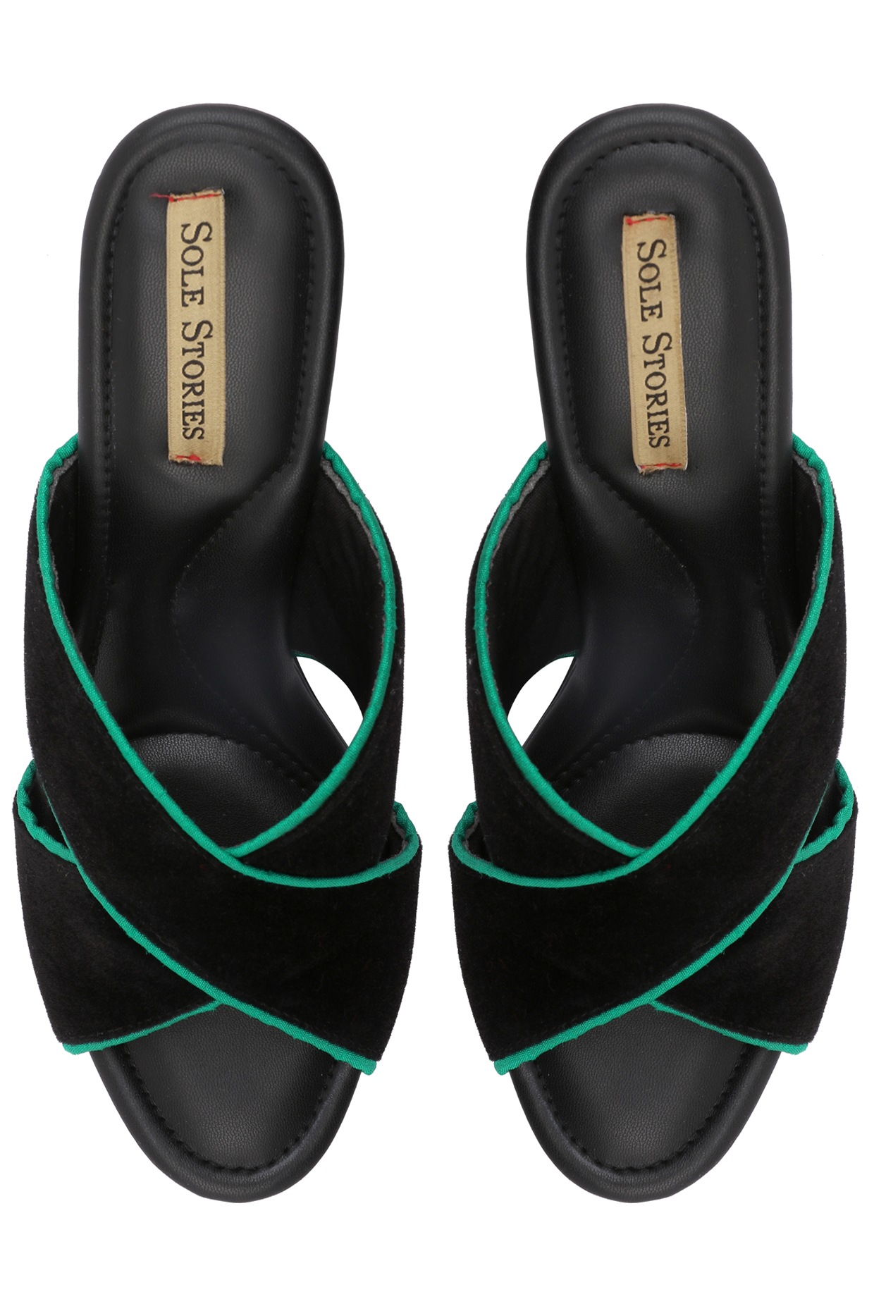 Black criss cross mules available only at Pernia's Pop Up Shop. 2025