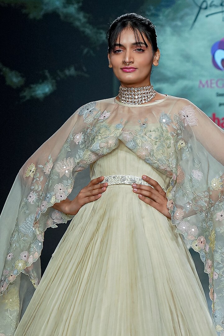 Light Yellow Organza Pleated Gown With Cape by Yaksi Deepthi Reddy at ...